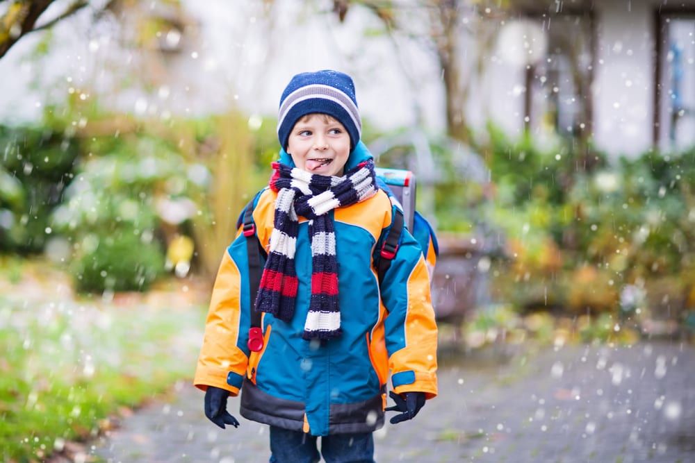 boy eating snowflakes - Wyoming Department of Health