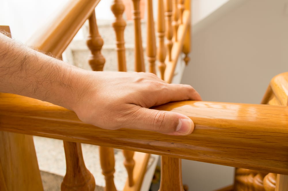 hand on safe stairwell - Wyoming Department of Health