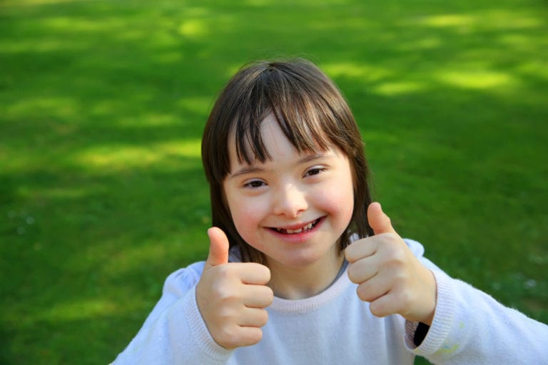 smiling disabled girl - Wyoming Department of Health