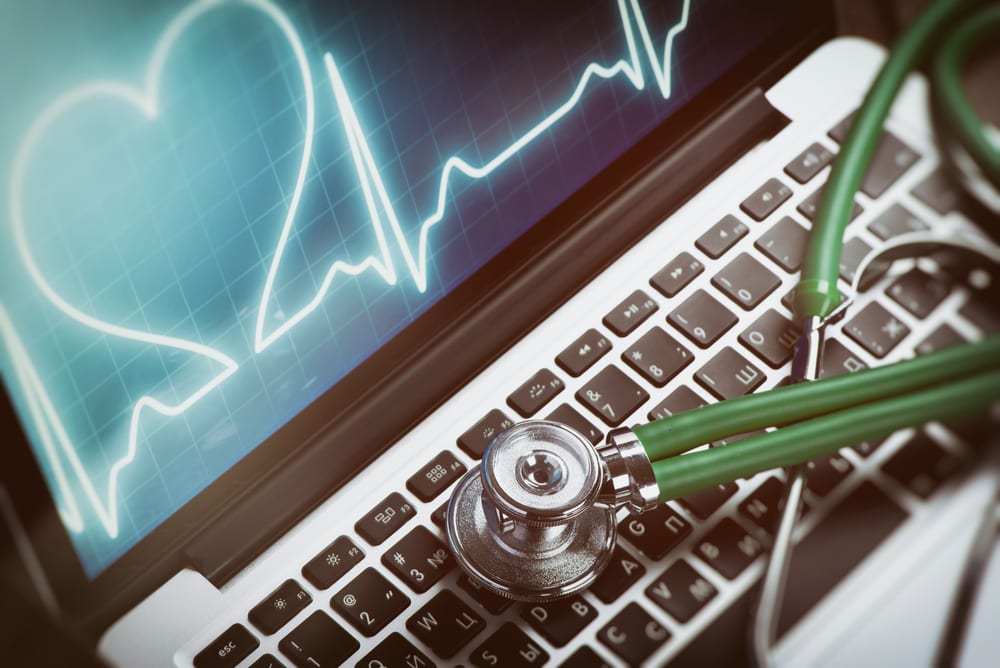 stethoscope on laptop - Wyoming Department of Health